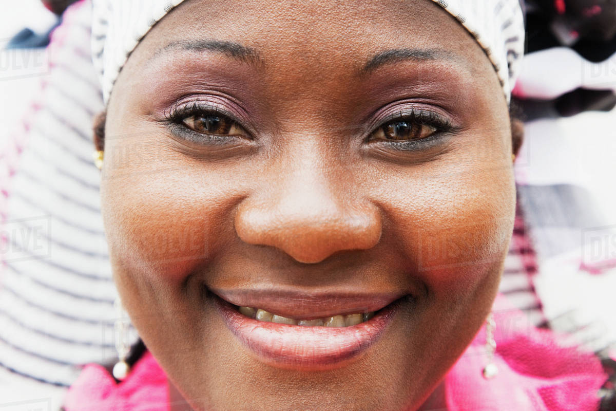 Close up of African woman smiling - Royalty-free Stock Photo | Dissolve