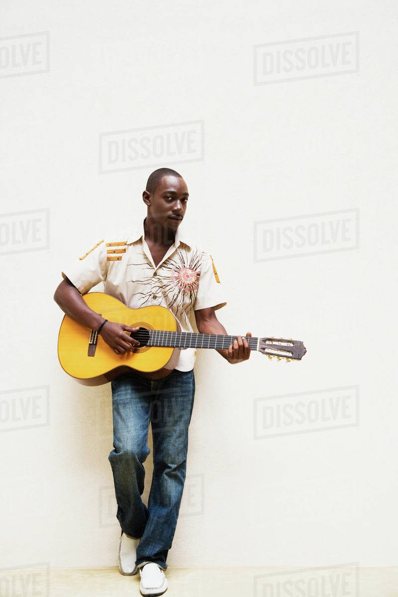 African man playing guitar - Stock Photo - Dissolve