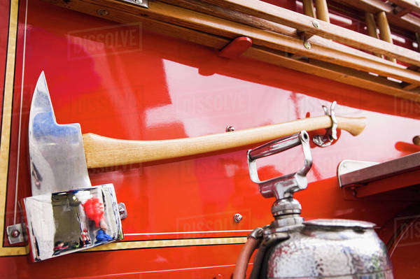 Axe on side of fire truck - Stock Photo - Dissolve