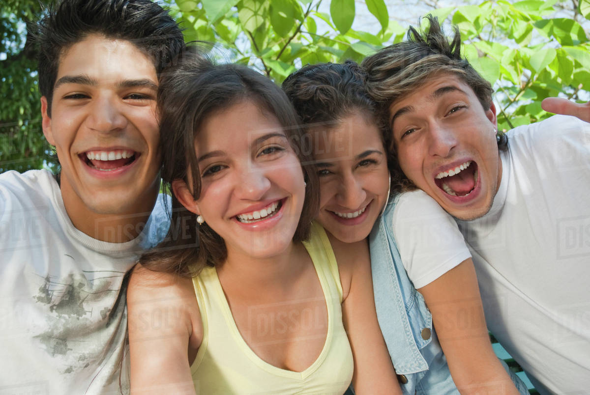 Laughing Hispanic friends - Royalty-free Stock Photo | Dissolve
