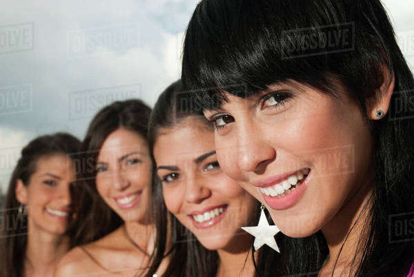 Friends standing a row - Royalty-free Stock Photo | Dissolve