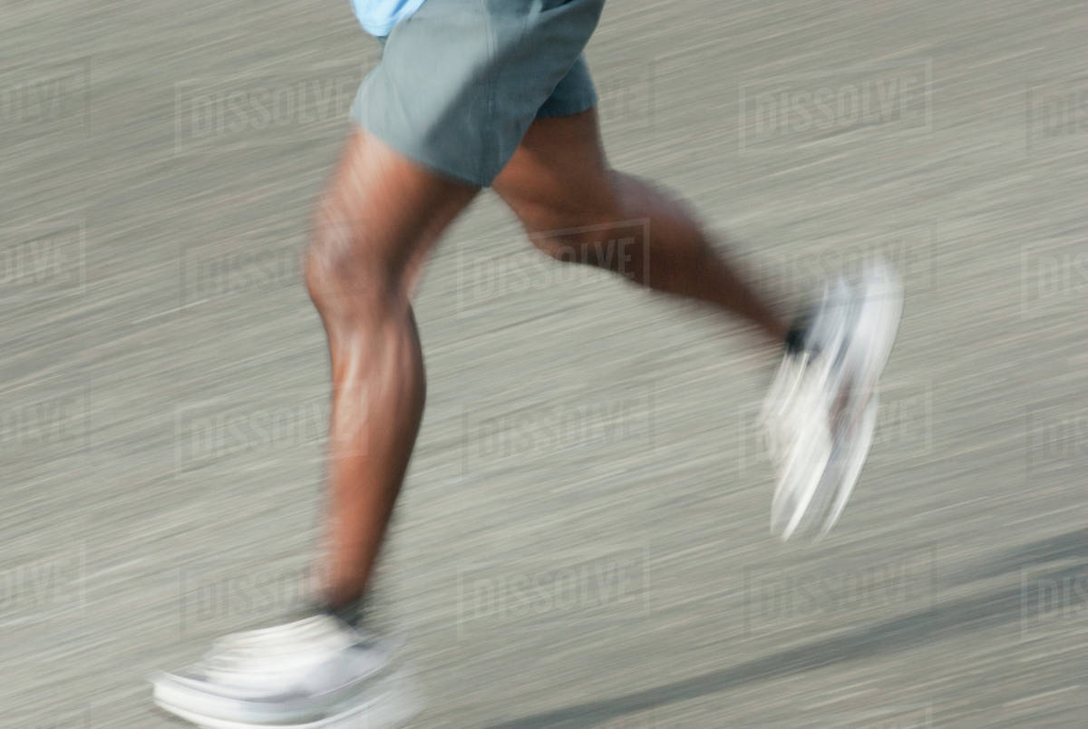 Blurred runner's legs running - Royalty-free Stock Photo | Dissolve