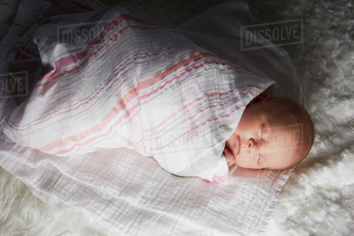 Newborn baby swaddled in blanket - Royalty-free Stock Photo | Dissolve