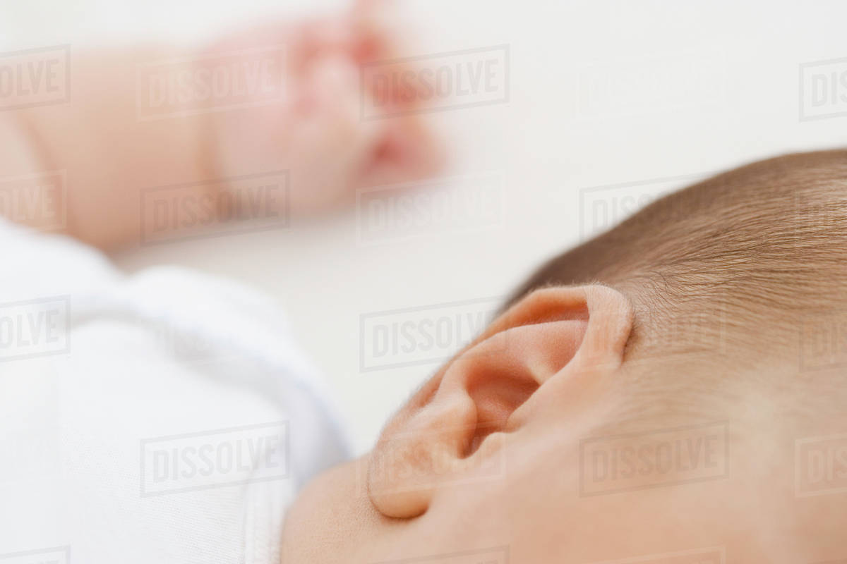 Close up of newborn baby's ear - Royalty-free Stock Photo | Dissolve