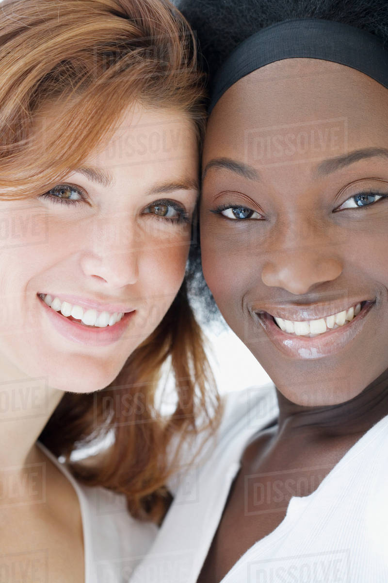 Close up of two women smiling - Stock Photo - Dissolve