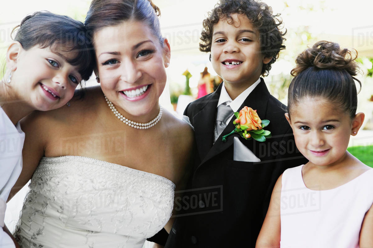 Bride and children hugging - Stock Photo - Dissolve