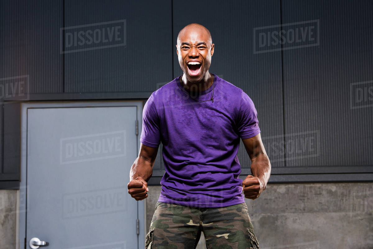 Black man cheering - Royalty-free Stock Photo | Dissolve