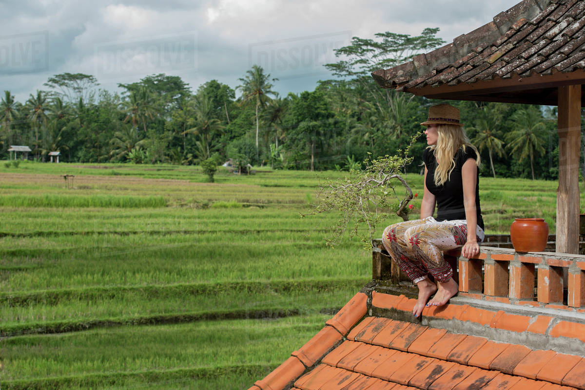 Caucasian woman overlooking rural fields from balcony - Stock Photo ...