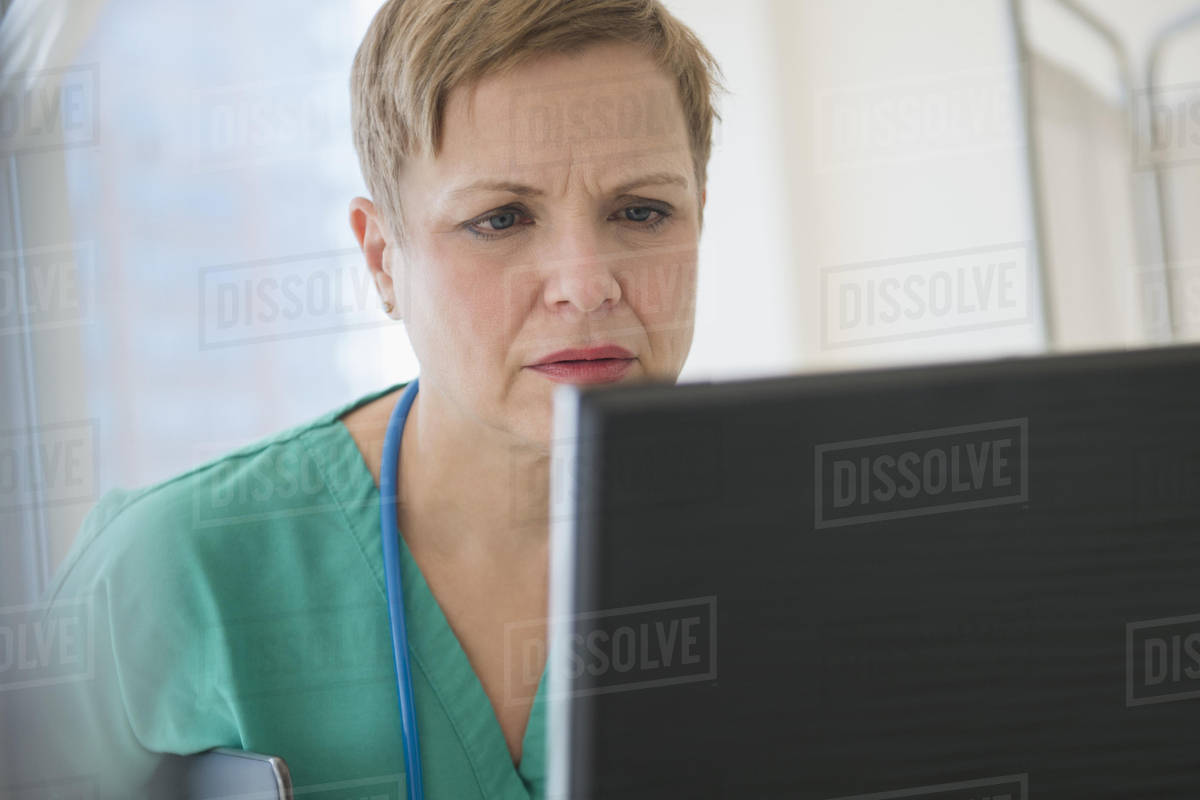 Close up of Caucasian nurse using computer - Royalty-free Stock Photo ...