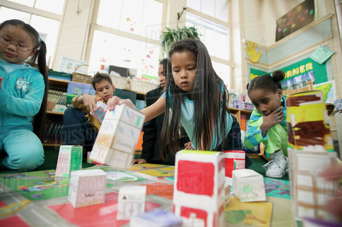 Multi-ethnic students in classroom - Royalty-free Stock Photo | Dissolve