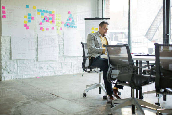 Businessman using digital tablet in office - Royalty-free Stock Photo ...