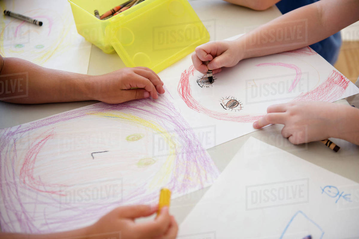Students drawing in classroom - Royalty-free Stock Photo | Dissolve