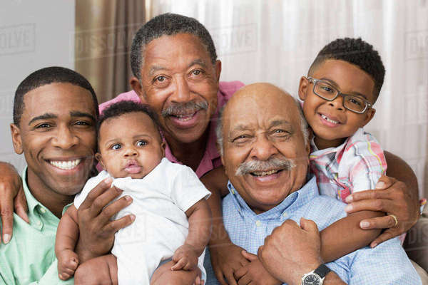 Four generations of Black men smiling - Stock Photo - Dissolve