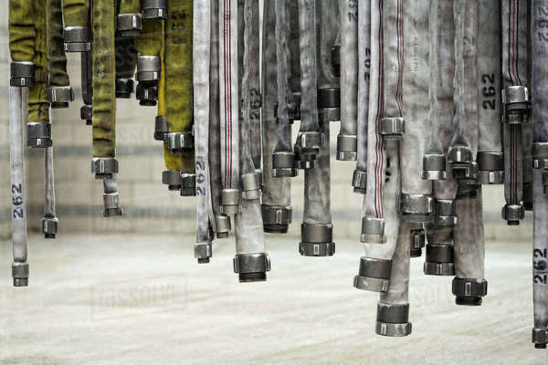 Detail of hanging fire hoses - Royalty-free Stock Photo | Dissolve