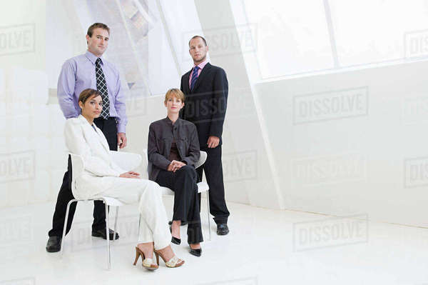 Caucasian business people posing in modern office - Royalty-free Stock ...