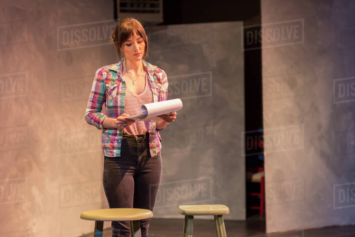 Hispanic actress rehearsing on theater stage - Royalty-free Stock Photo ...