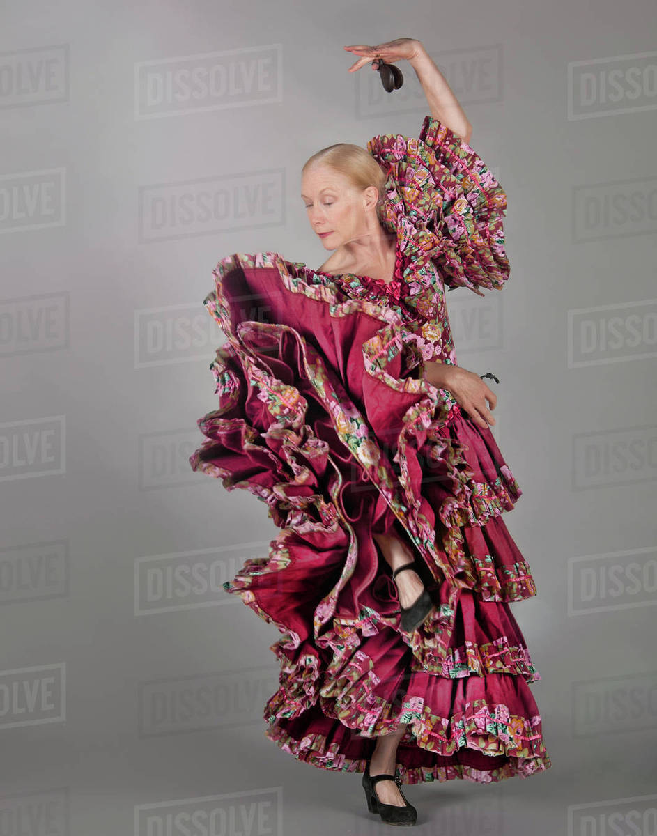 Caucasian woman dancing in ornate dress - Royalty-free Stock Photo ...