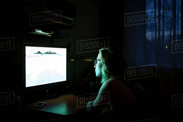 Caucasian woman using computer at night - Royalty-free Stock Photo ...