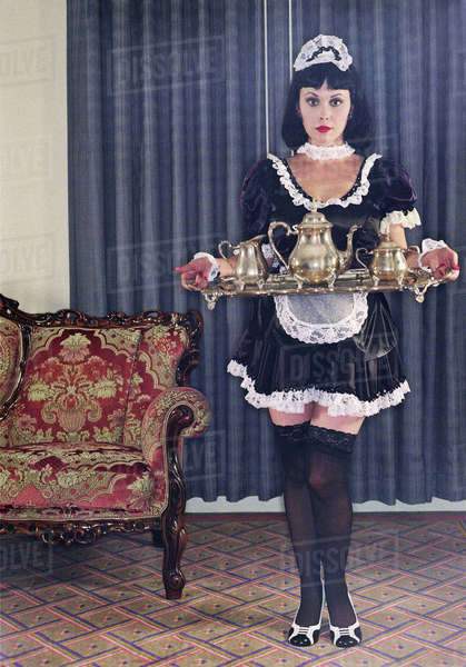 Maid serving tea in ornate living room - Royalty-free Stock Photo ...