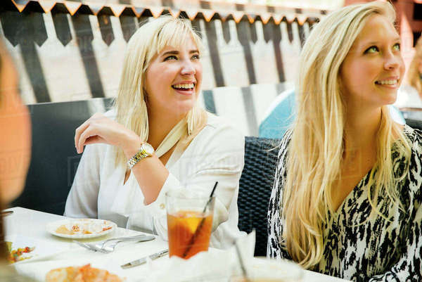 Caucasian customers smiling in restaurant - Royalty-free Stock Photo ...