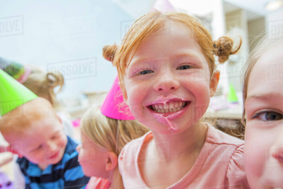 Caucasian girl with icing on lips at party - Royalty-free Stock Photo ...