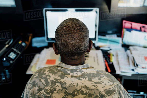 Black soldier using computer - Royalty-free Stock Photo | Dissolve