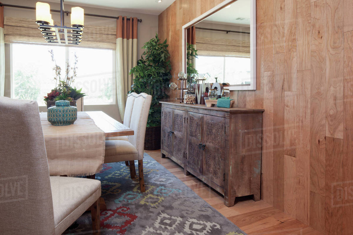 Dining area and sideboard at home - Royalty-free Stock Photo | Dissolve
