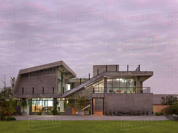 Front exterior modern home at sunset - Royalty-free Stock Photo | Dissolve