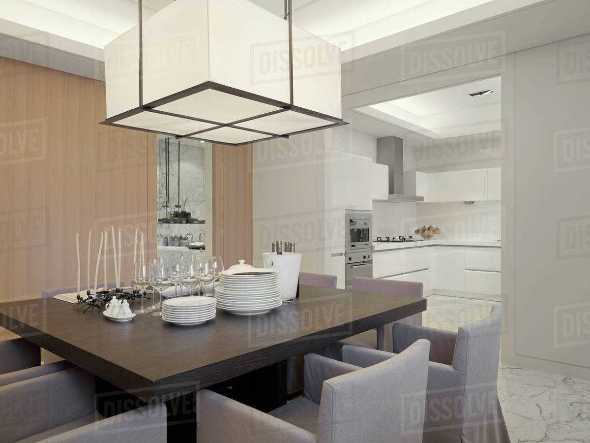 Stacked plates on dining table - Royalty-free Stock Photo | Dissolve