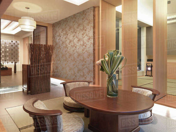 Contemporary dining room table in asian dining room - Royalty-free ...