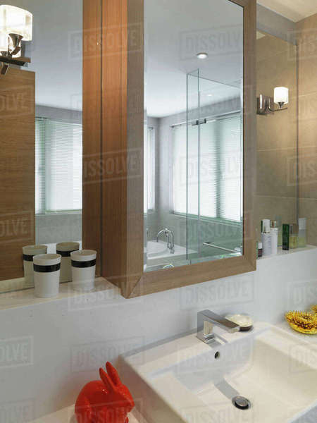 Sink and mirrors in modern bathroom - Royalty-free Stock Photo | Dissolve