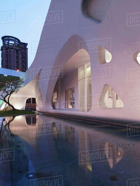 Exterior white modern building at dusk - Stock Photo - Dissolve