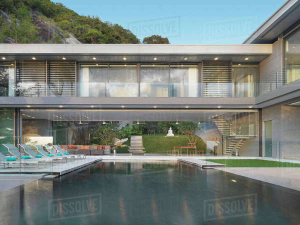 Multiple story modern home with swimming pool out front - Stock Photo ...