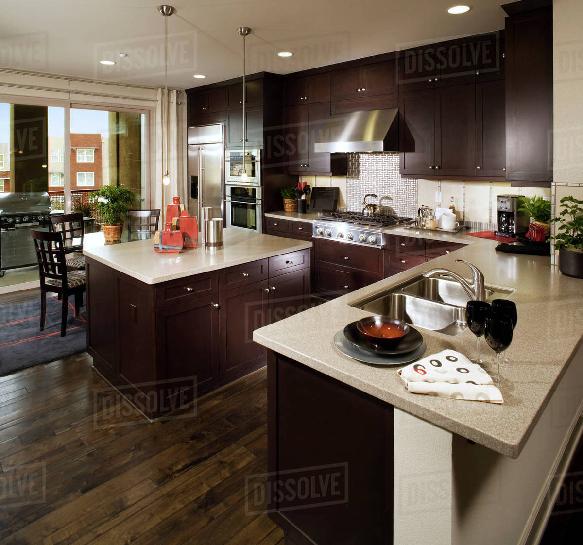 Brown wooden cabinets in contemporary kitchen - Stock Photo - Dissolve
