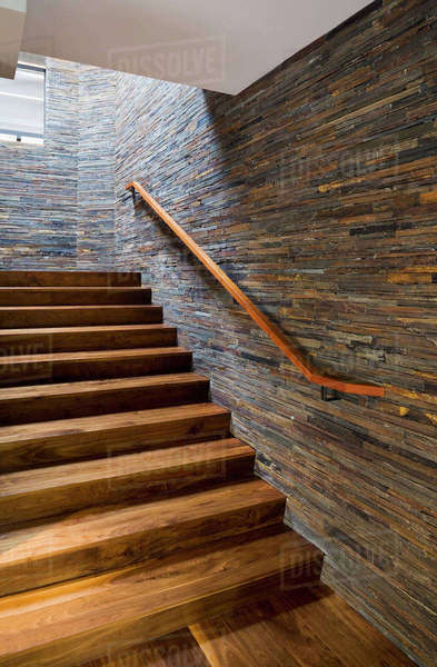 Hardwood Staircase with Stone Tile Wall - Stock Photo - Dissolve