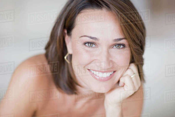 Portrait of smiling woman - Stock Photo - Dissolve