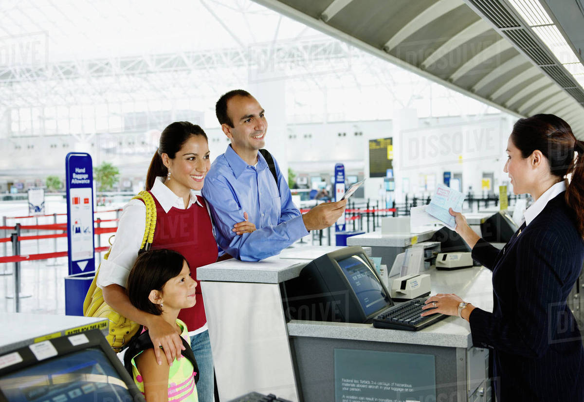 Hispanic family checking in at airport - Royalty-free Stock Photo ...