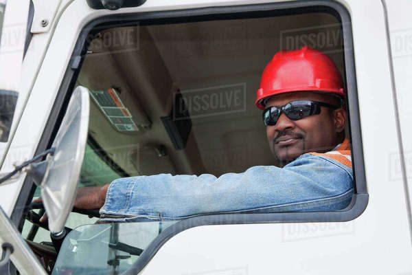 African construction worker driving truck - Royalty-free Stock Photo ...