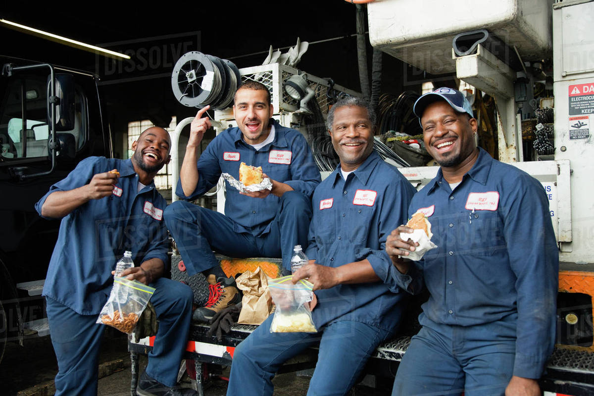 Mechanics eating lunch together - Royalty-free Stock Photo | Dissolve