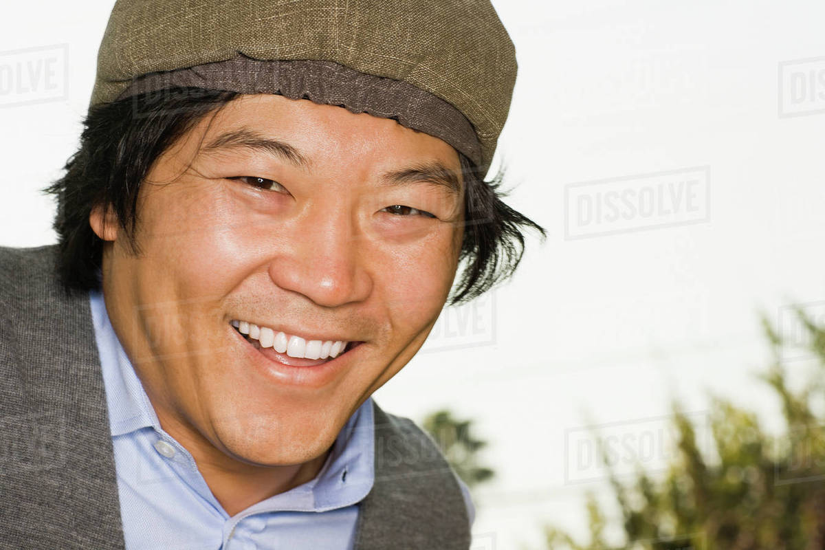Asian man smiling - Royalty-free Stock Photo | Dissolve