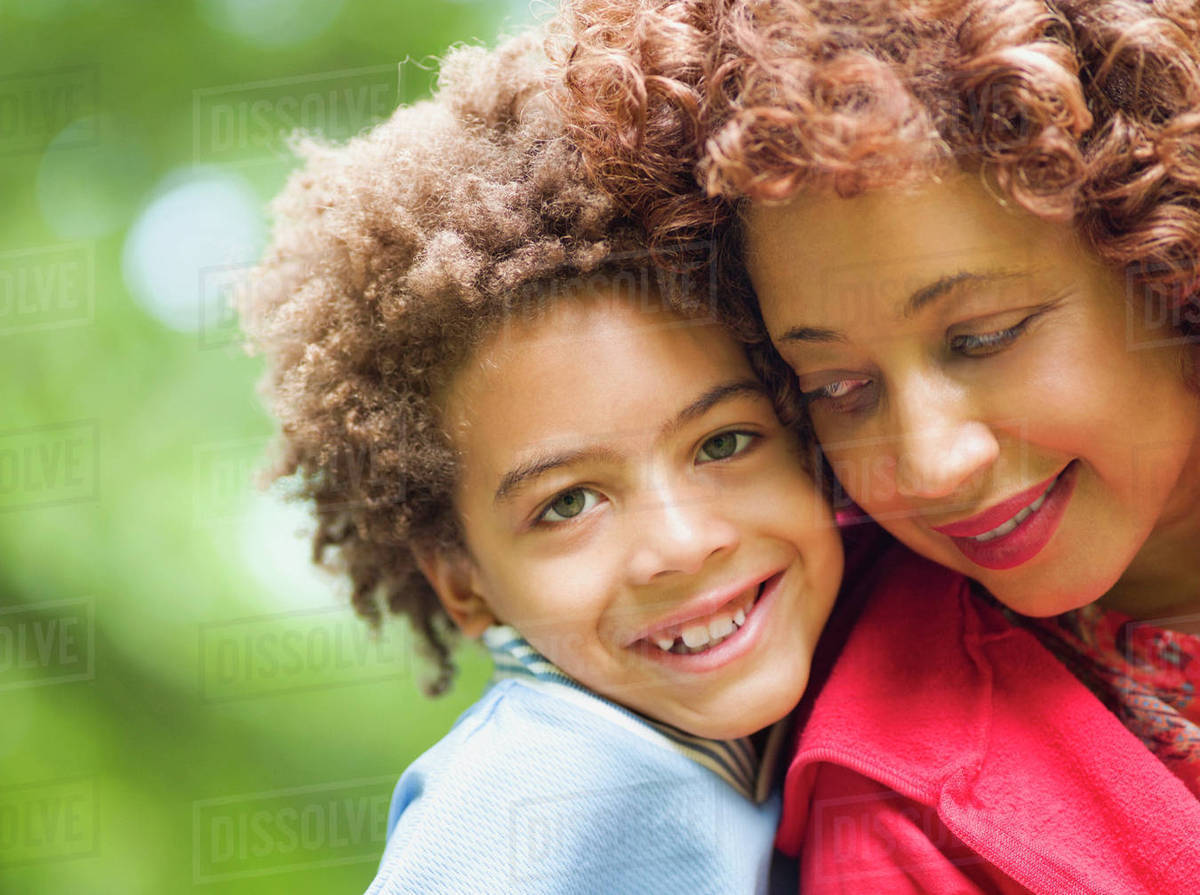 Mother and son smiling - Stock Photo - Dissolve