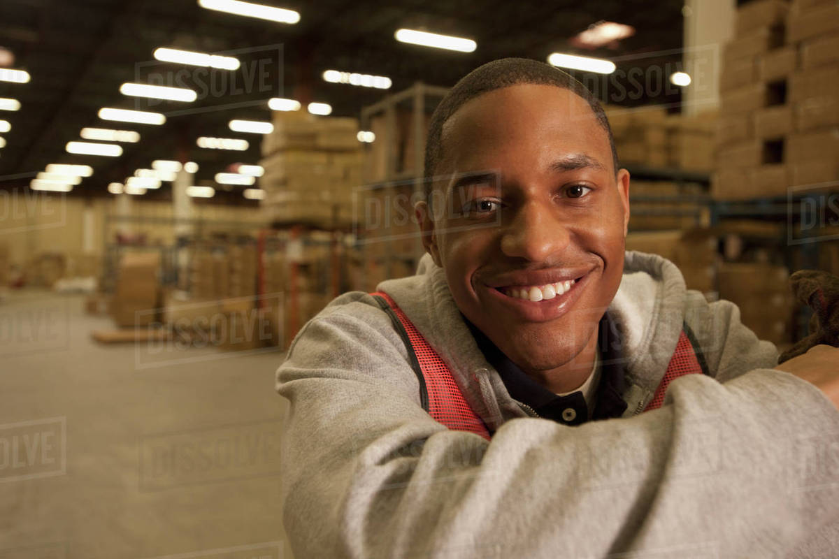 Black man working in warehouse - Royalty-free Stock Photo | Dissolve