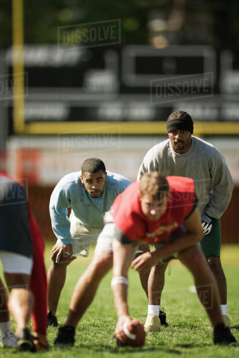 Men playing football - Stock Photo - Dissolve