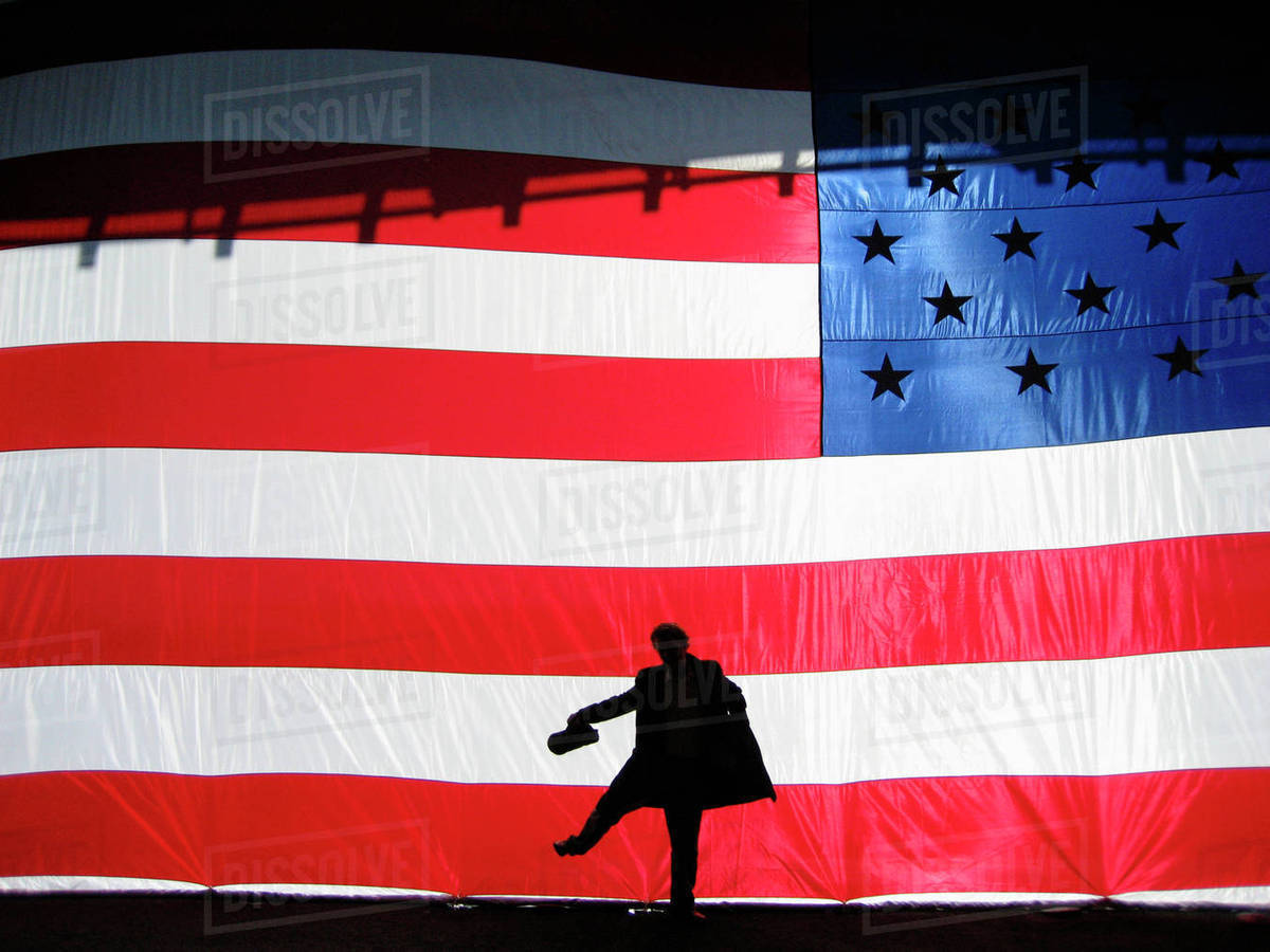 Silhouette of man behind American flag - Royalty-free Stock Photo ...