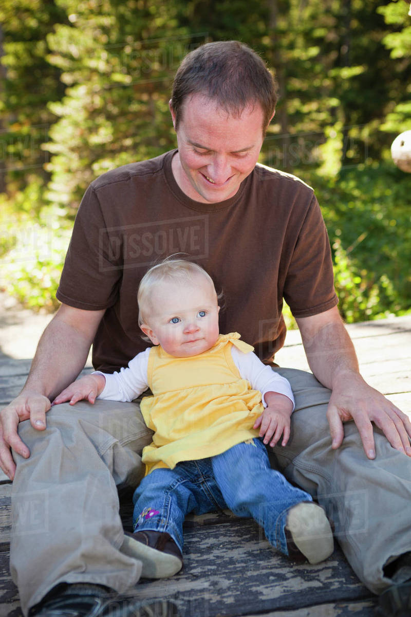 Caucasian father sitting with daughter - Royalty-free Stock Photo ...