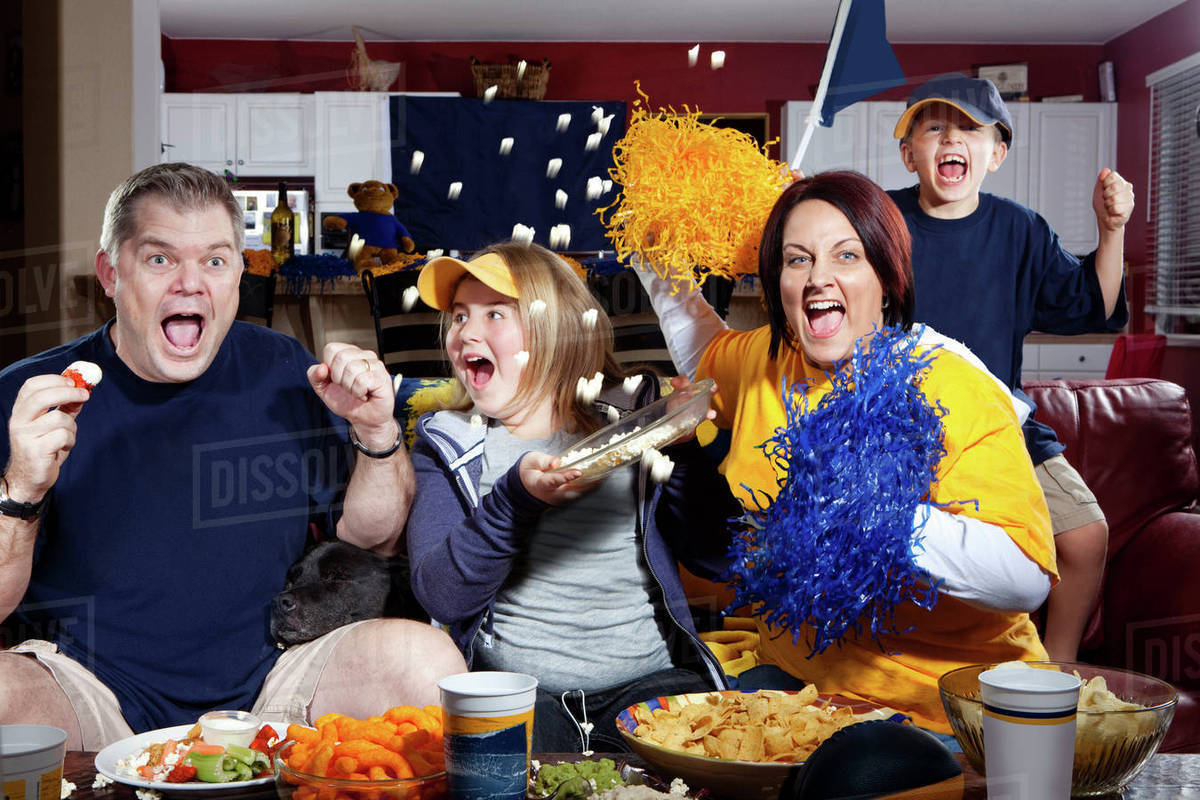 Cheering Caucasian family watching sports - Royalty-free Stock Photo ...