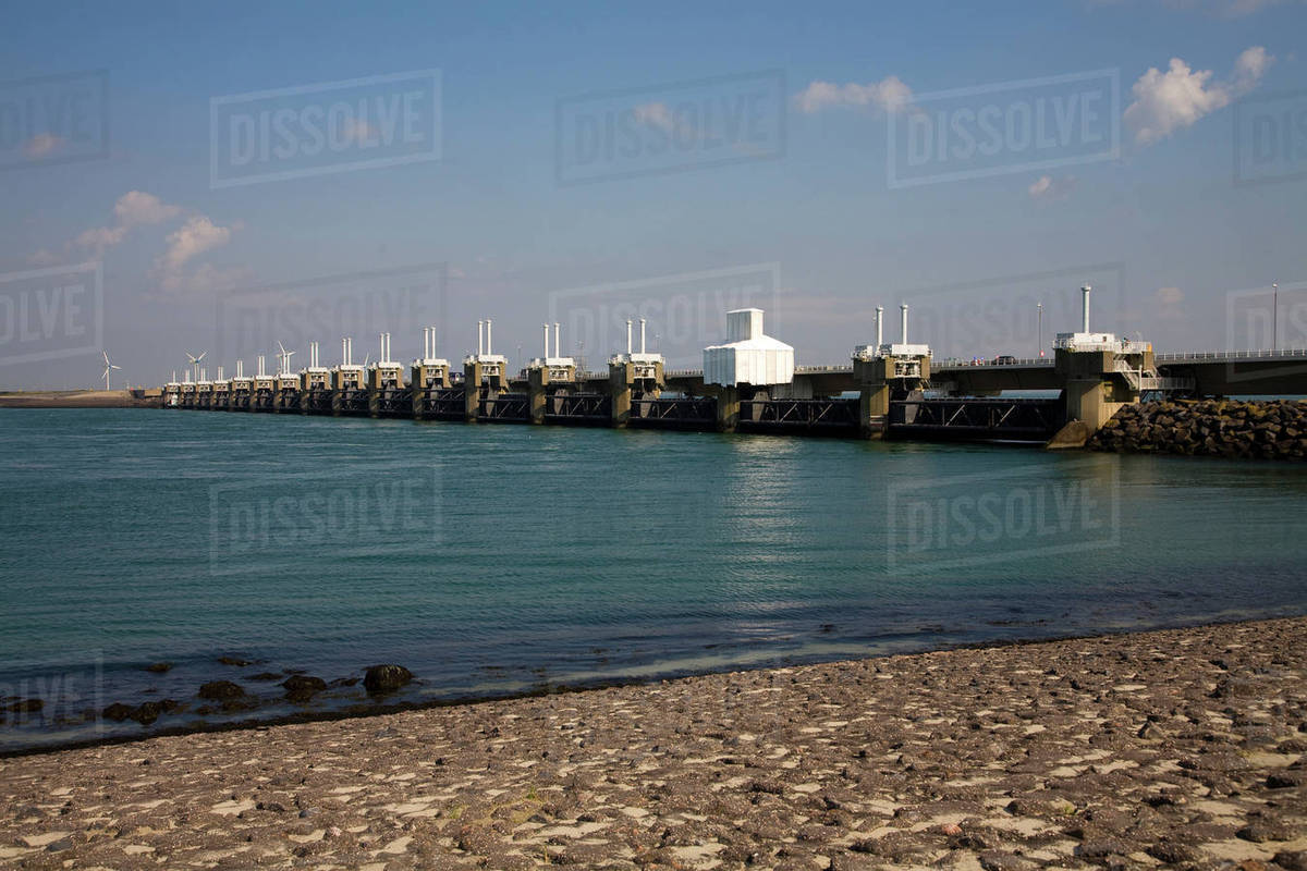 Dam across ocean - Stock Photo - Dissolve