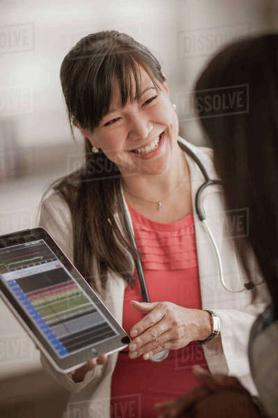 Doctor showing digital tablet to patient - Royalty-free Stock Photo ...