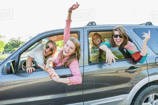 Playful friends in car - Stock Photo - Dissolve
