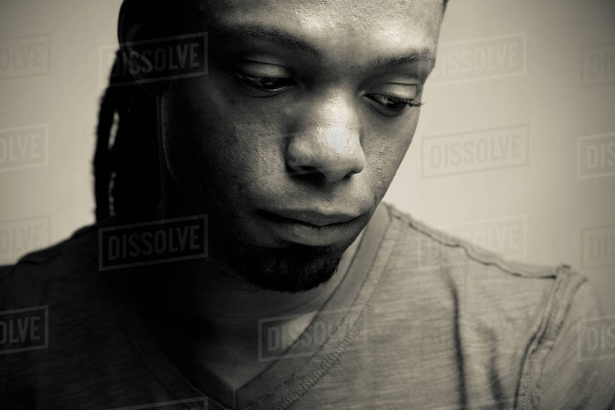 Serious African American man looking down - Royalty-free Stock Photo ...